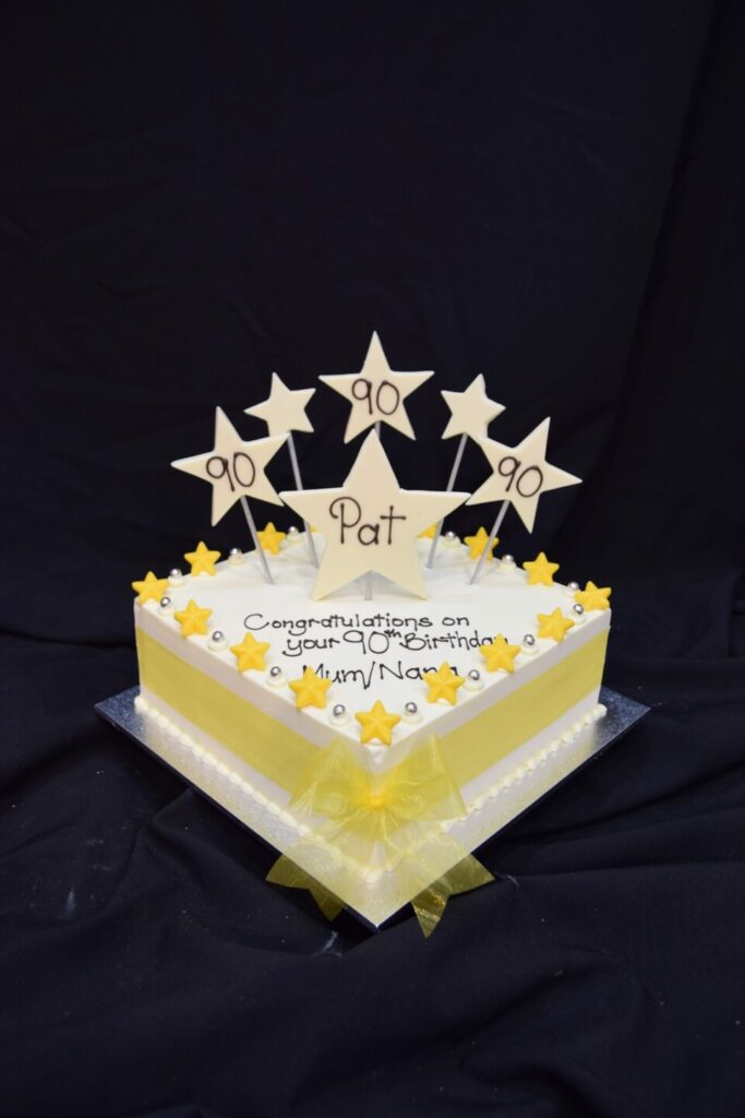 Yellow and White Stars on Smooth Buttercream – Heidelberg Cakes